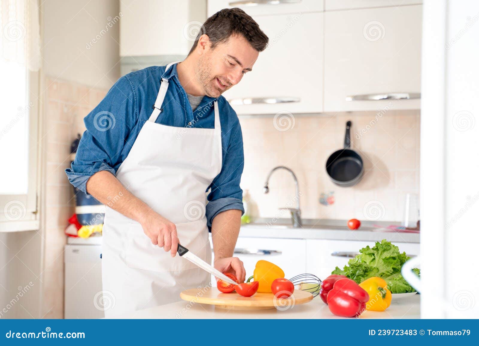 Man Cutting Some Vegetables and Cooking at Home Stock Image - Image of ...