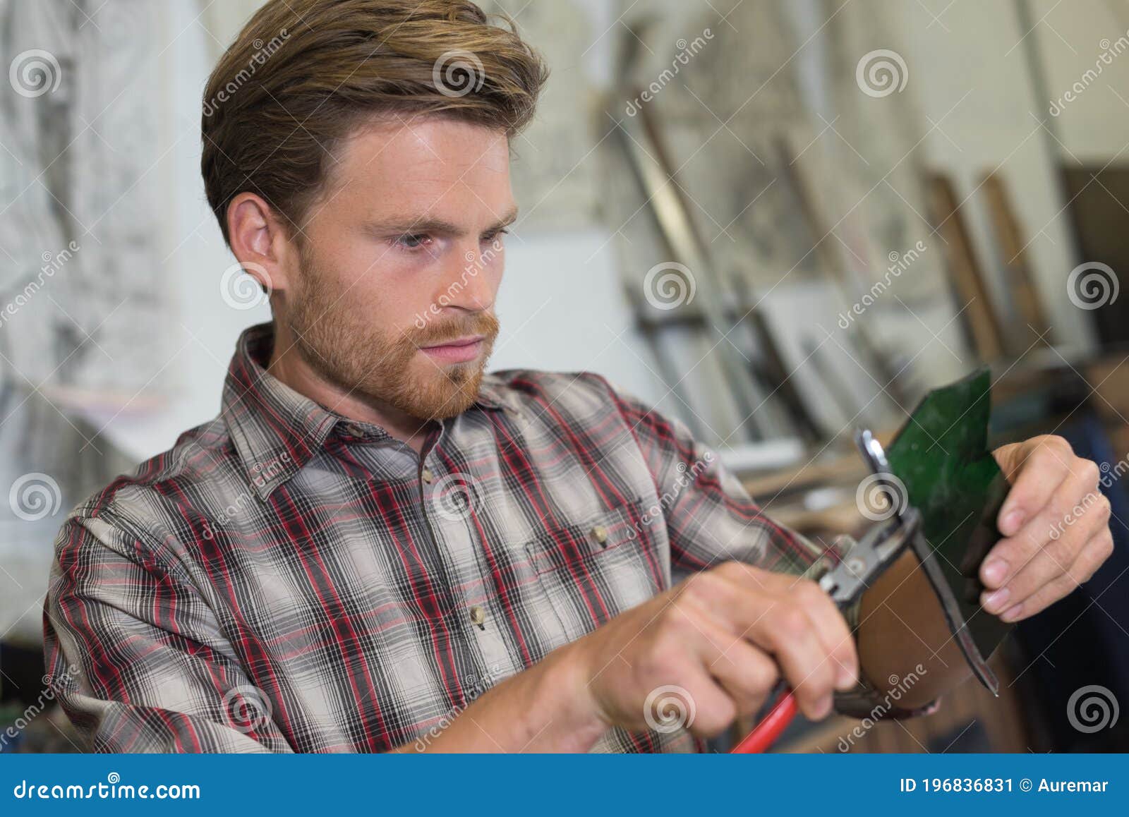 Man Cutting Something with Metal Tool Stock Image - Image of object ...