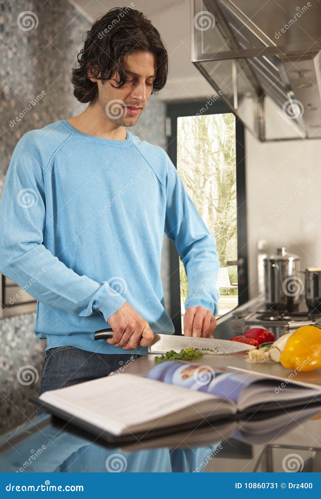 Man cutting vegetables stock image. Image of division - 10860731