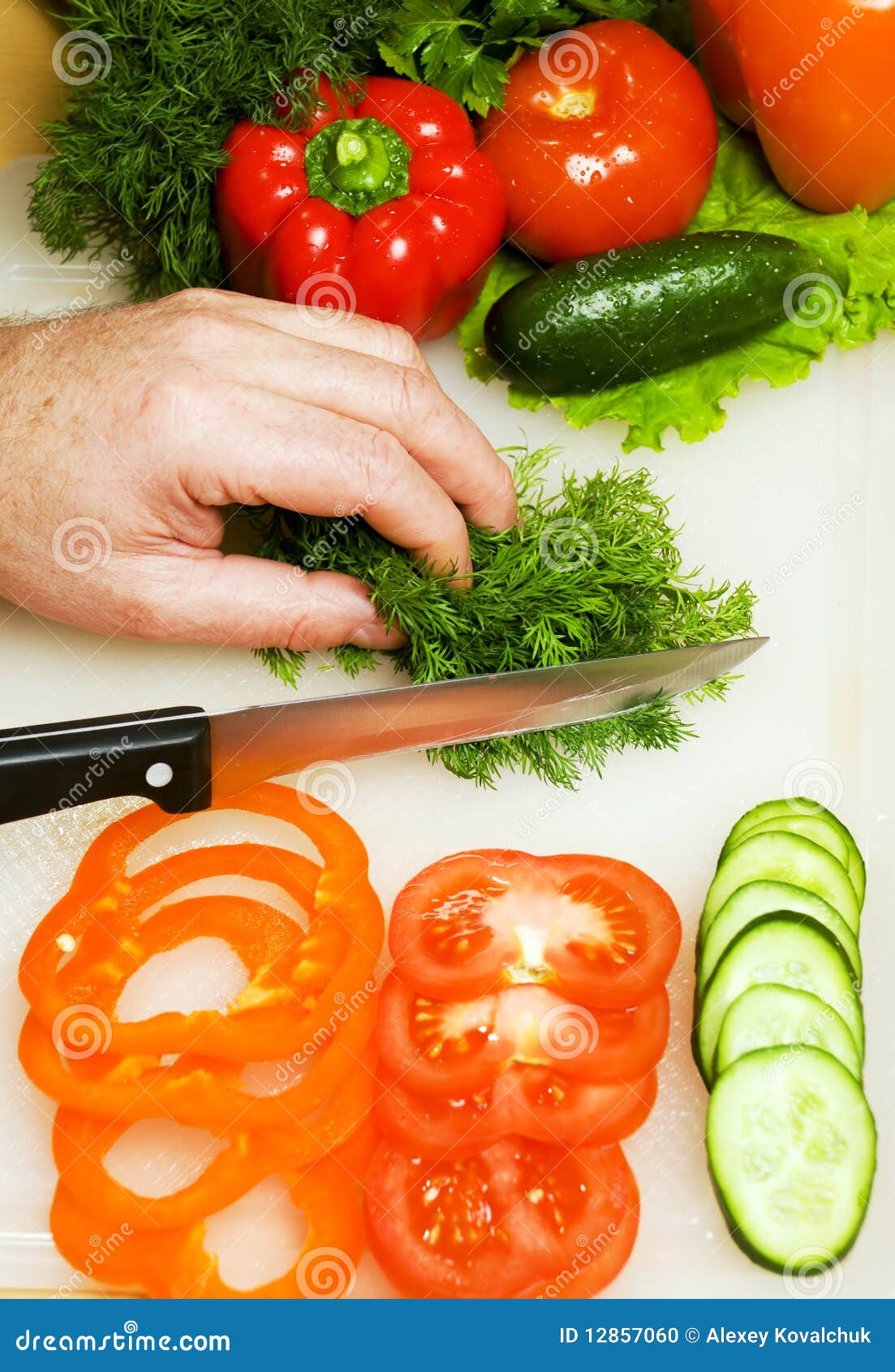 Man cutting vegetables stock photo. Image of cutting - 12857060