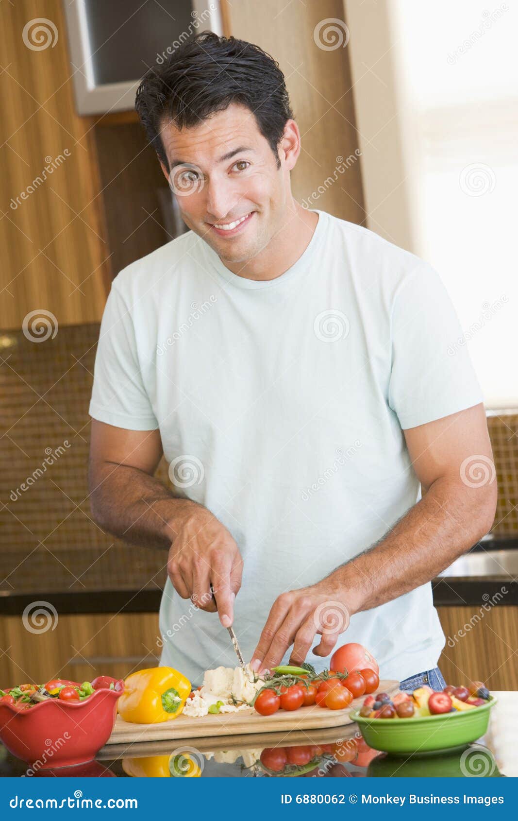 Man Cutting Vegetables stock photo. Image of color, smiling - 6880062