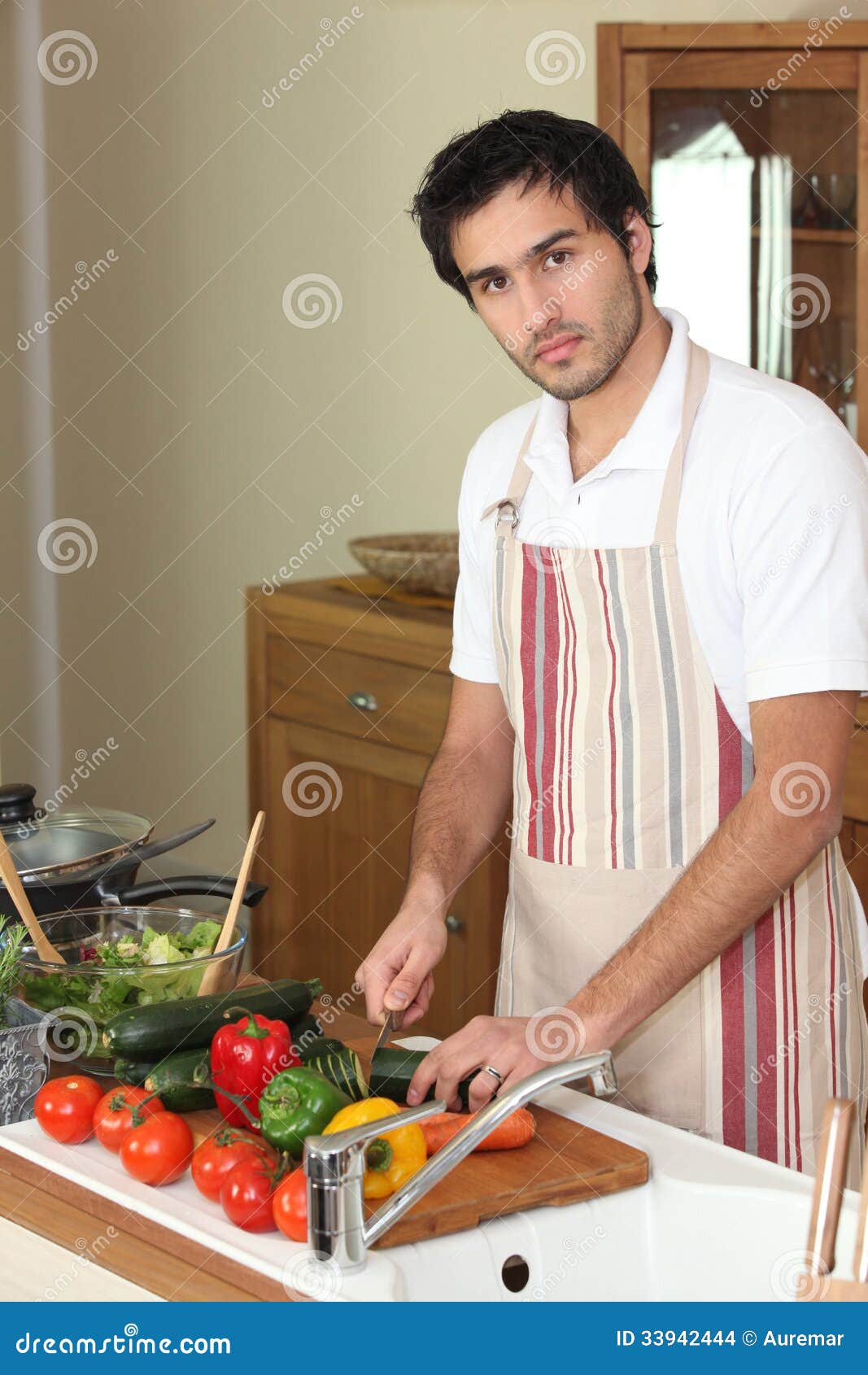 Man cutting vegetables stock photo. Image of preparation - 33942444