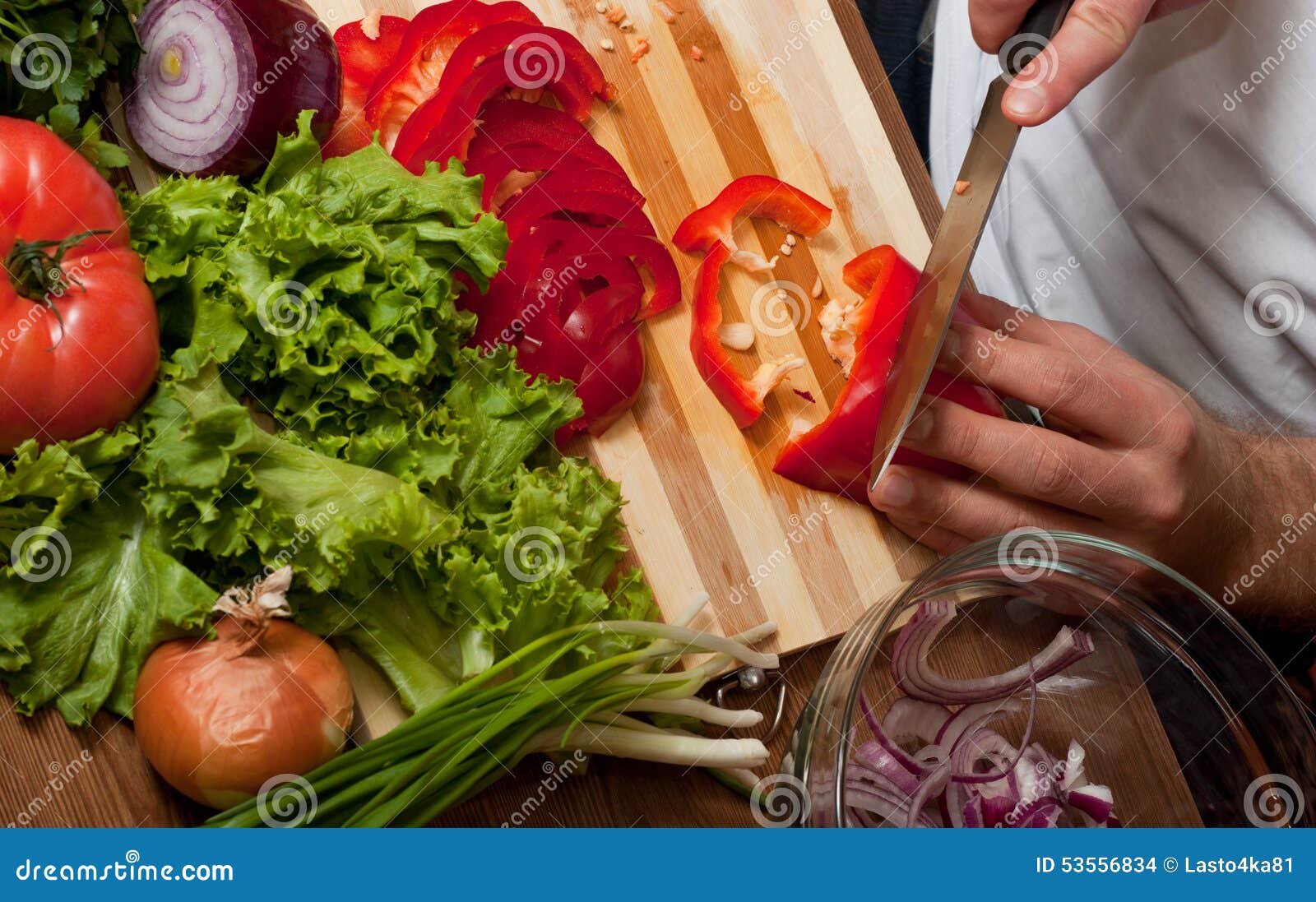 Man cutting vegetables stock photo. Image of closeup - 53556834