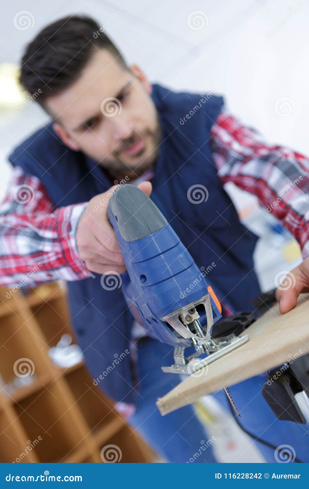 Man Cutting Wood with Saw Blade Stock Photo - Image of safety, placard ...