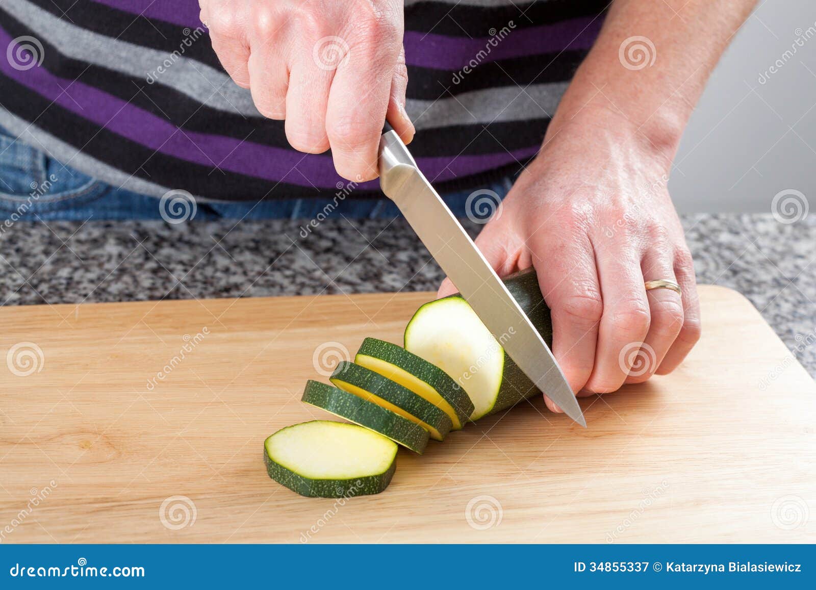 Man cutting a zucchini stock image. Image of ingredient - 34855337