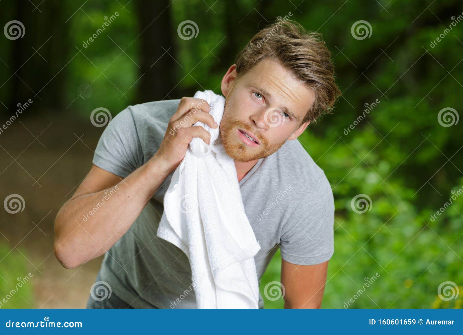 Man Dabbing Sweat from Neck after Exercising Stock Image - Image of ...