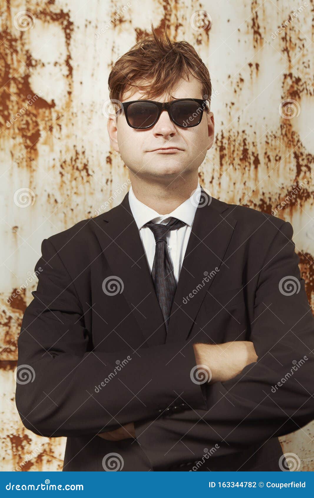 Man in Dark Suit and Tie Posing for Portrait by Rusty White Wall Stock ...