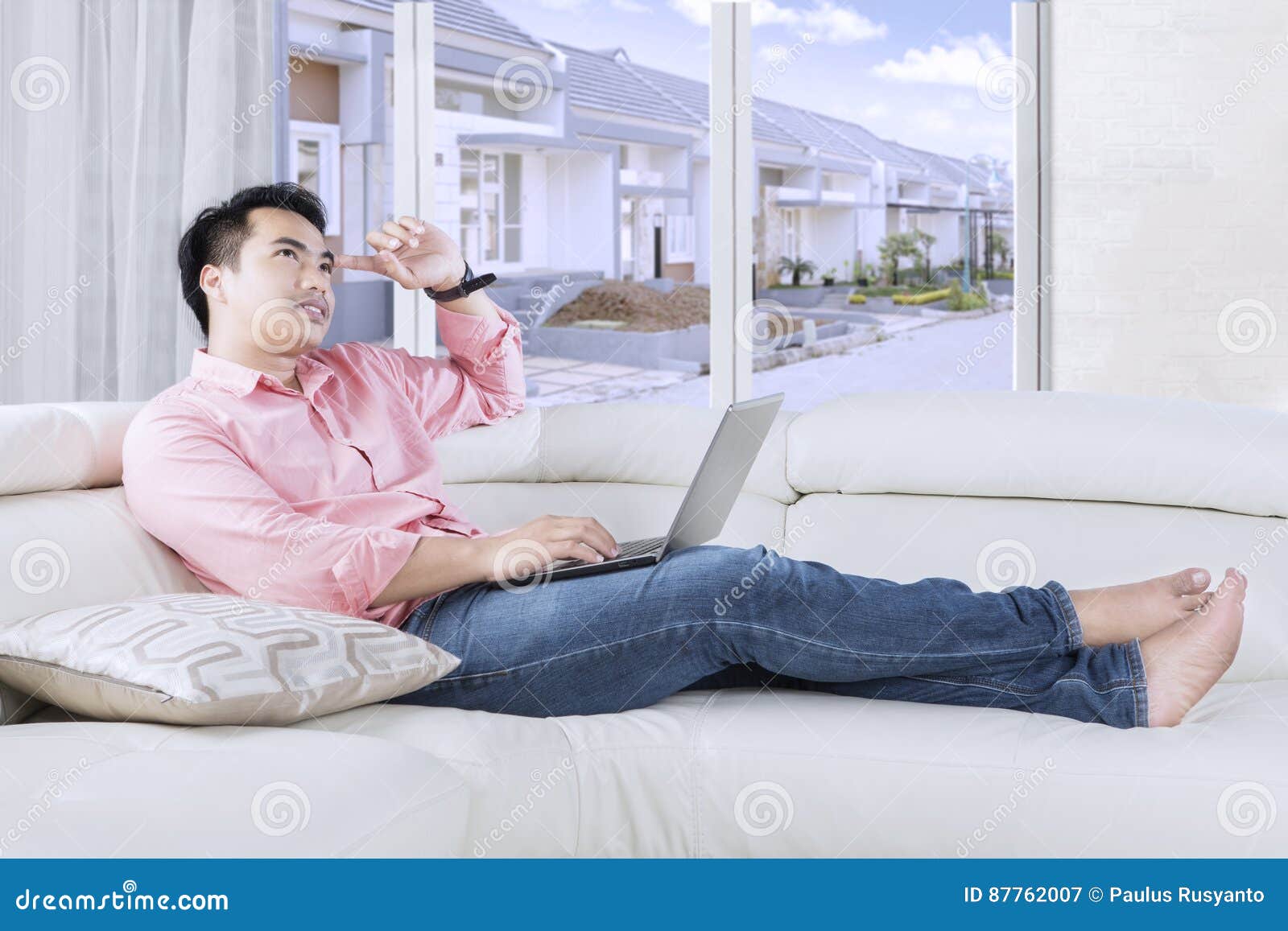 Man daydreaming on sofa stock image. Image of japanese - 87762007