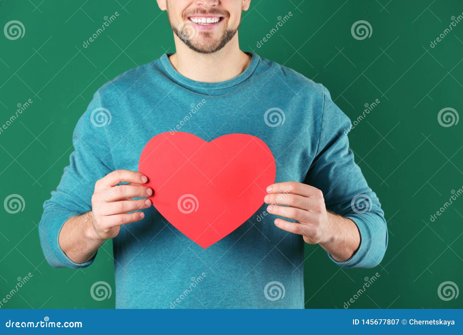 Man with Decorative Heart on Color Background Stock Image - Image of ...
