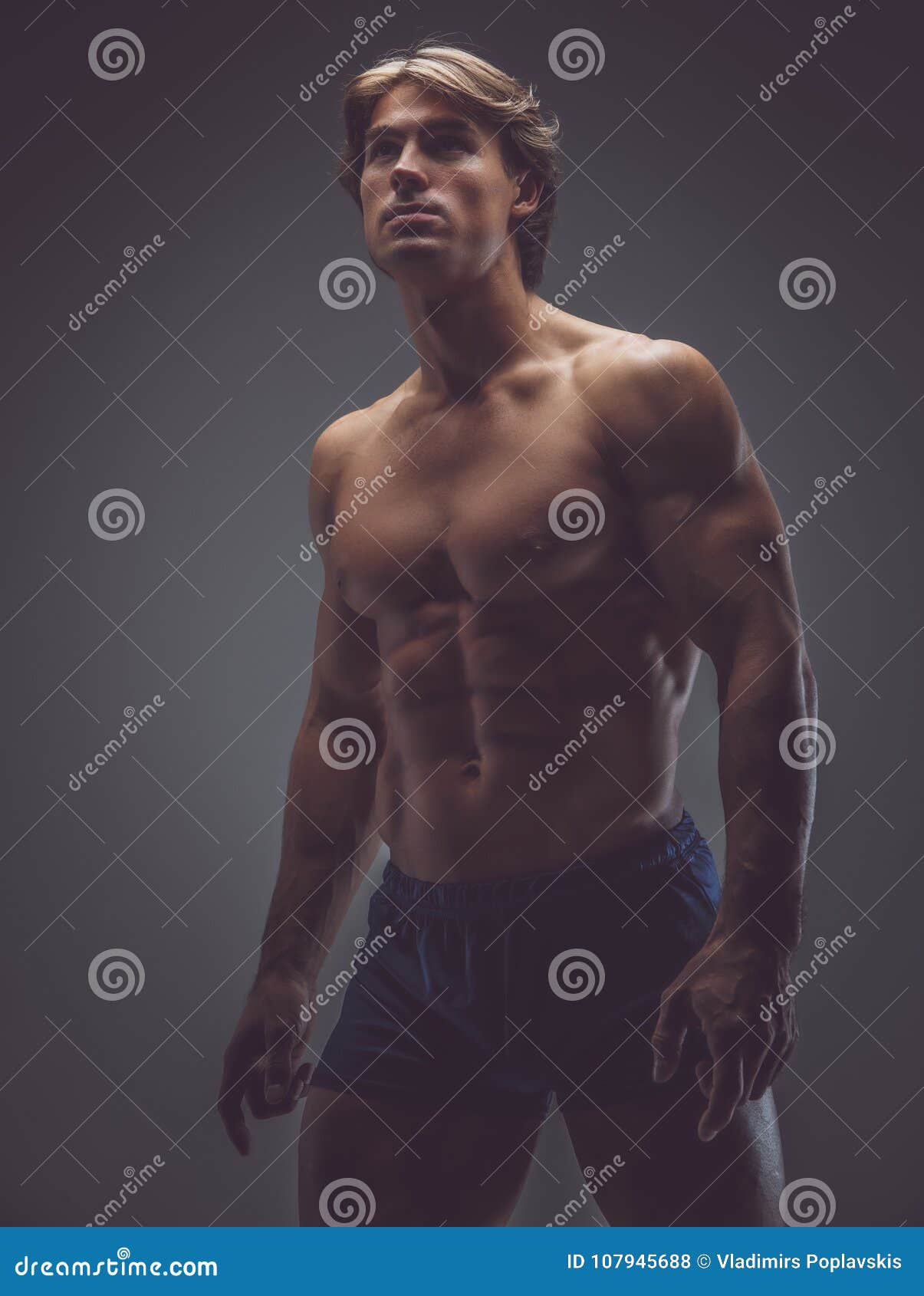 A man in a deep shadow. stock photo. Image of biceps - 107945688