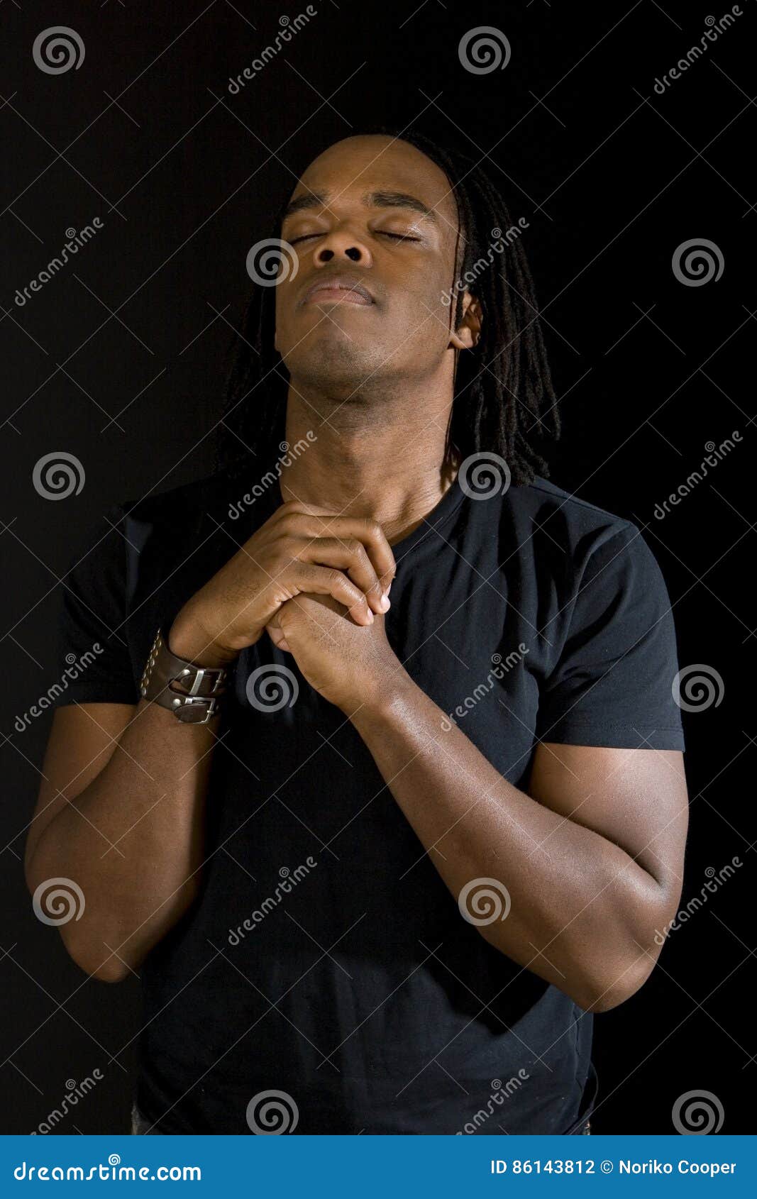 Man in Deep Thought Praying Isolated on Black. Stock Photo - Image of ...