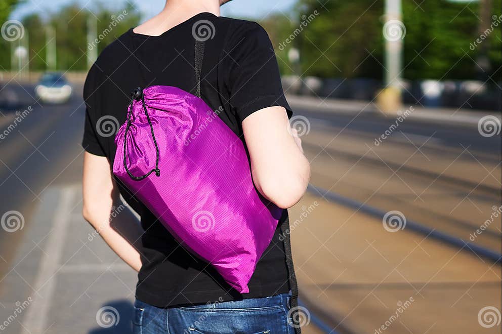 Man with Deflated Inflatable Sofa on the Road Stock Photo - Image of ...
