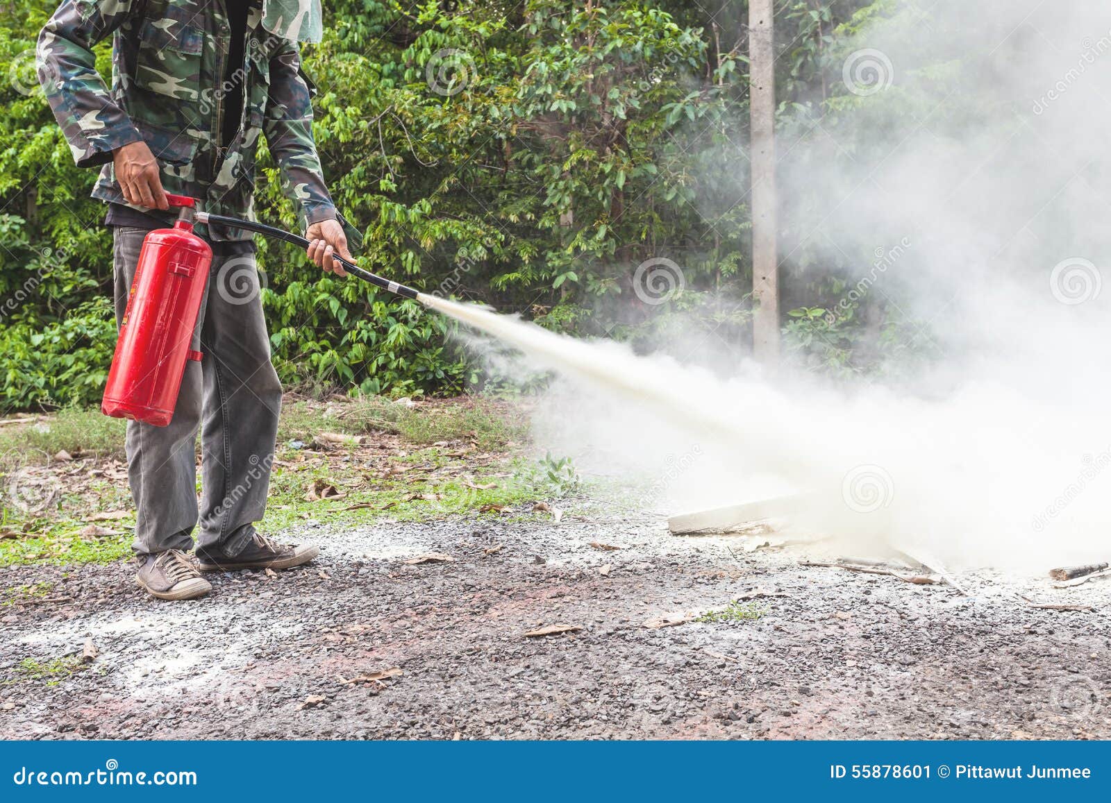 A Man Demonstrating How To Use a Fire Extinguisher Stock Image - Image ...