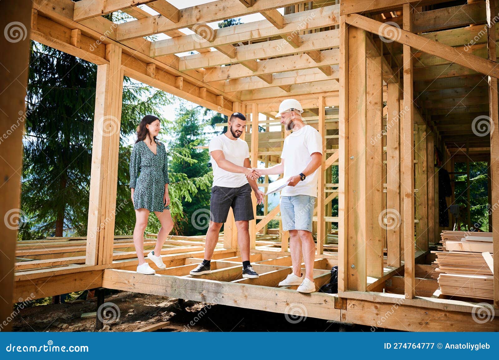 Man Designer with Plan Showing the Process of Constructing Wooden ...