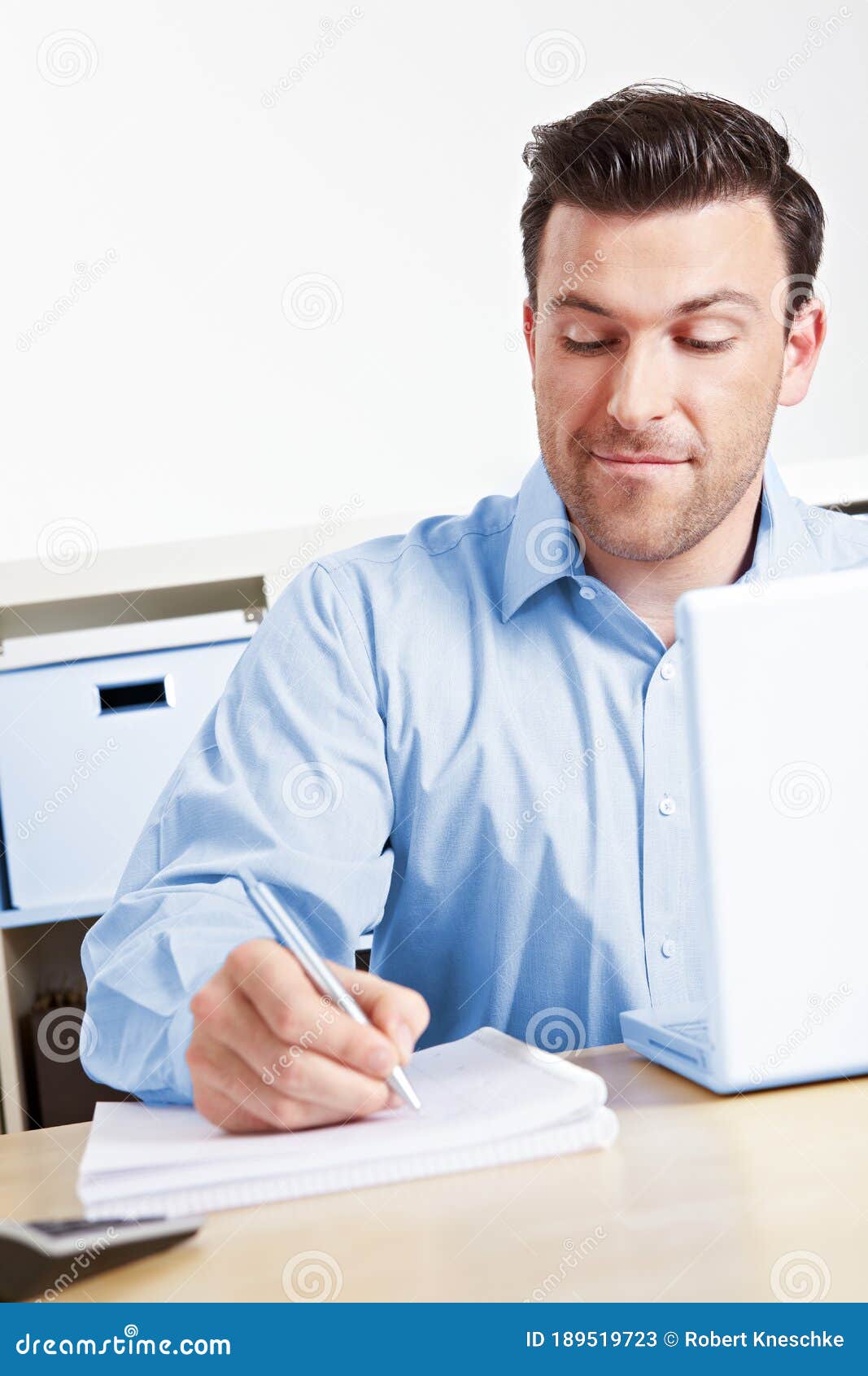 Man at the Desk Makes Notes Stock Image - Image of online, happy: 189519723