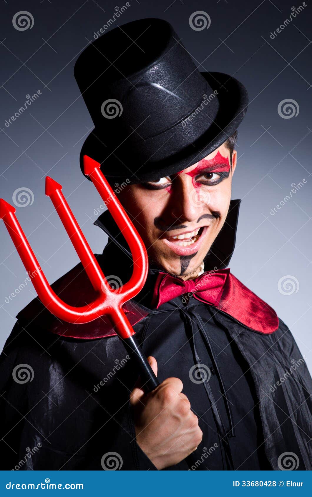 Man in devil costume stock photo. Image of fork, horns - 33680428
