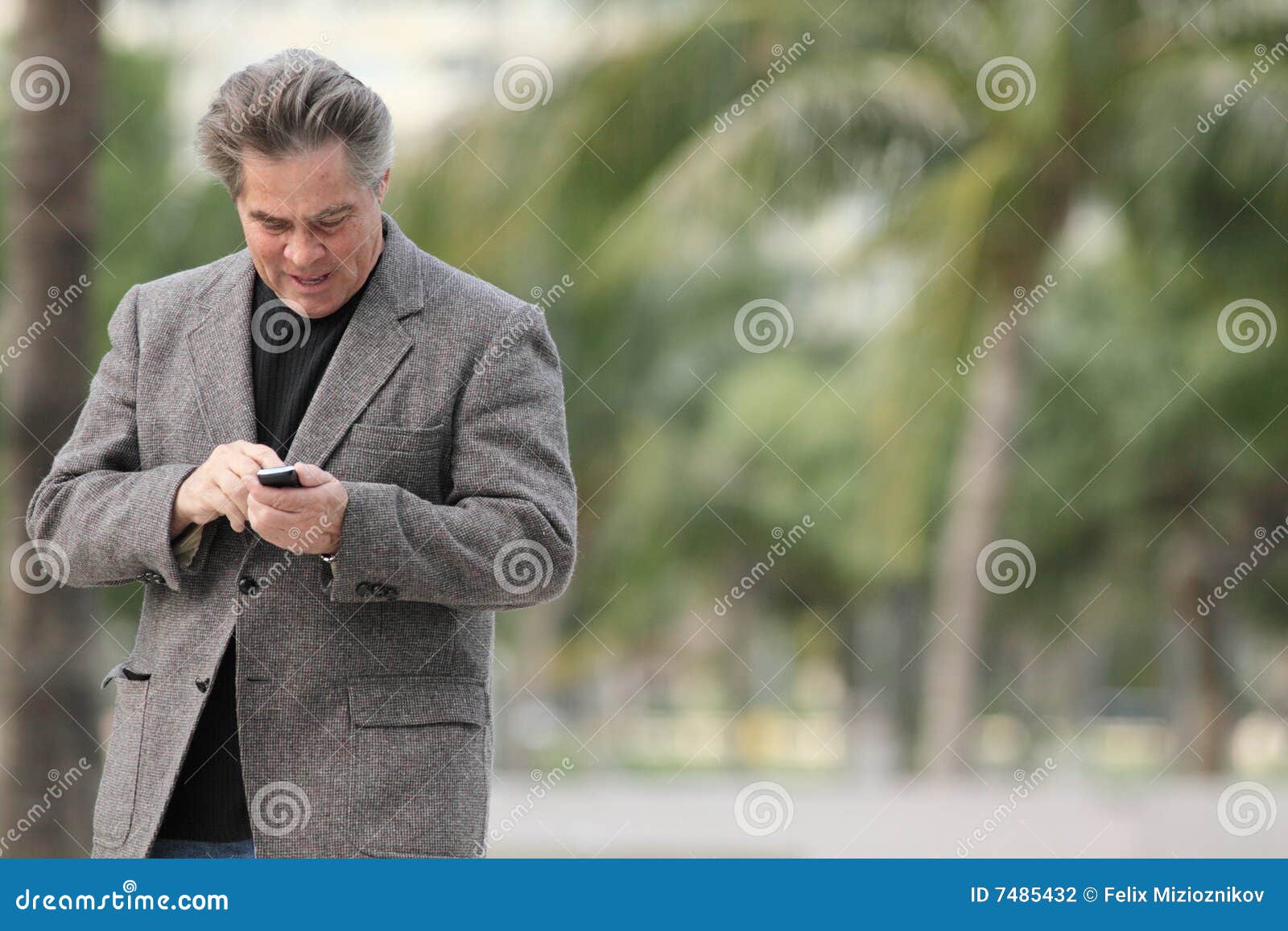 Man dialing his phone stock photo. Image of seccessful - 7485432