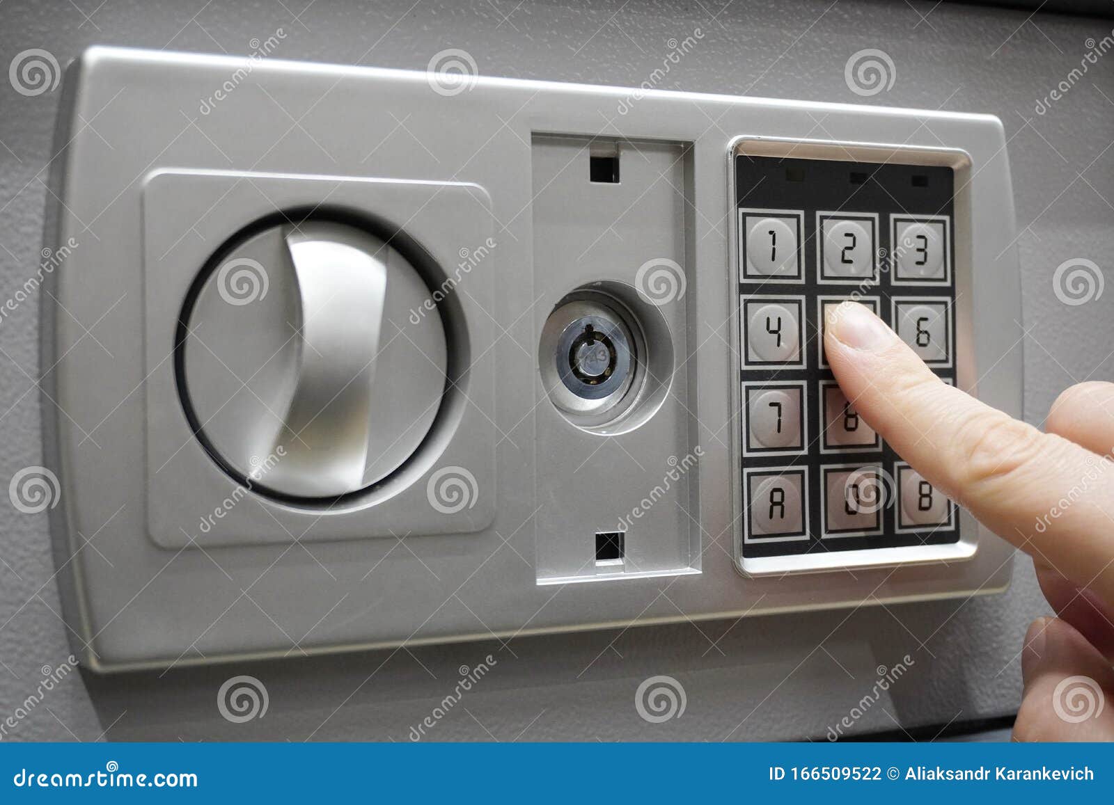 The Man Dials the Code To Close the Safe. Grey Safe Closure, Numeric ...