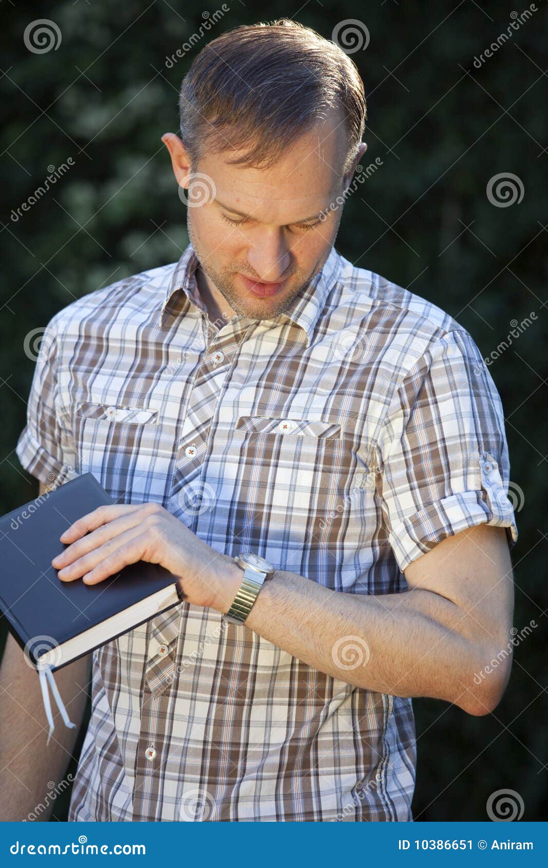 Man with Diary Looking at Watch Stock Image - Image of book, male: 10386651