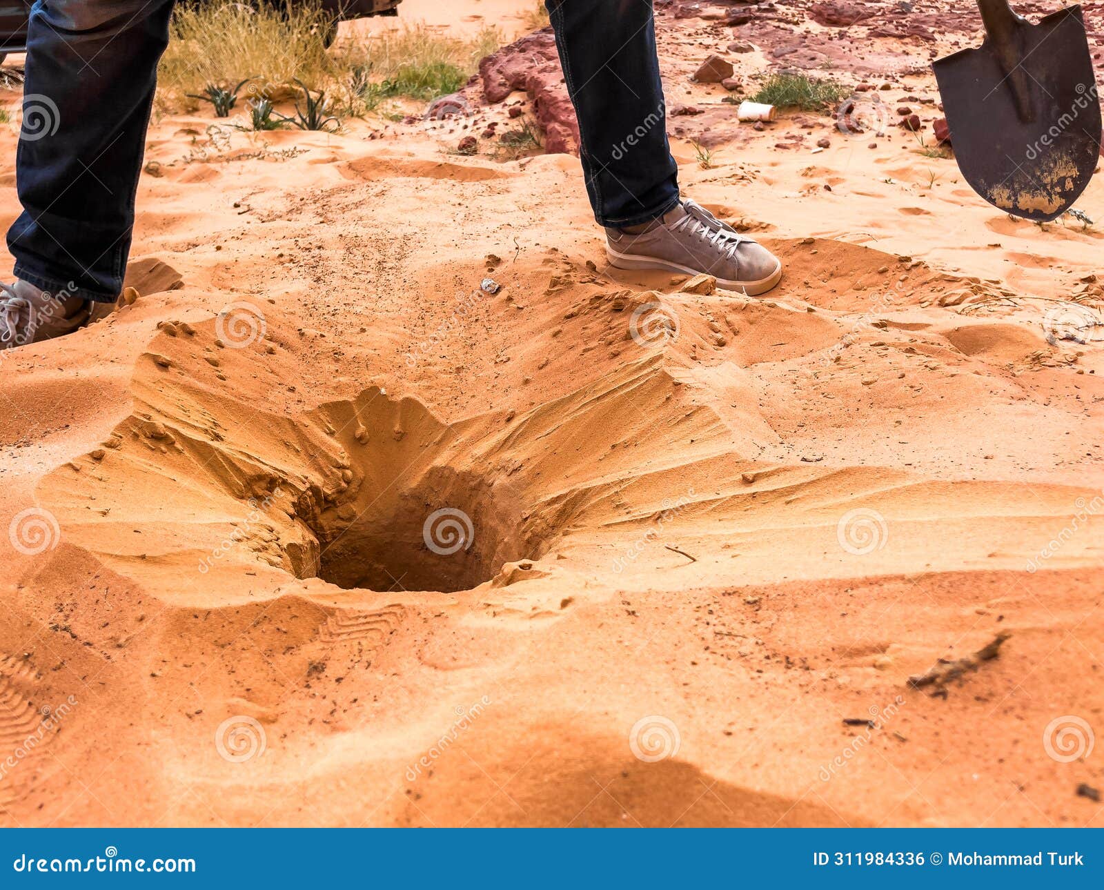 Man Digging a Hole in the Desert with a Shovel Stock Photo - Image of ...