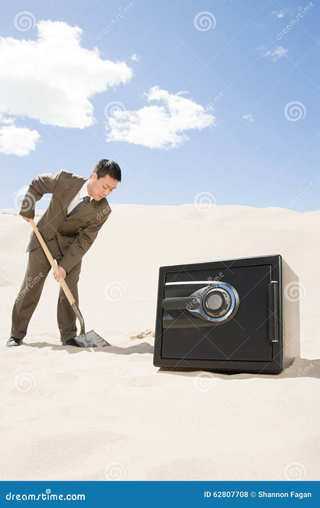 Man Digging by Safe in Desert Stock Photo - Image of economic, safety ...