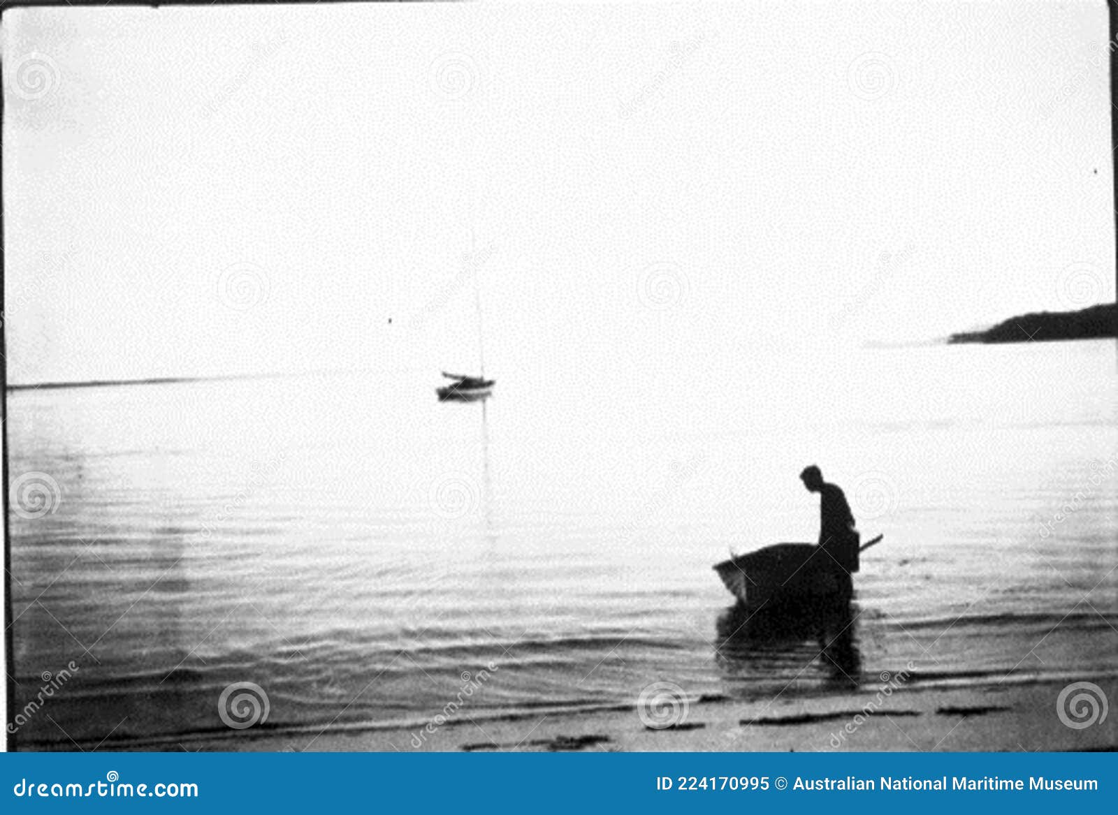 Man With A Dinghy In The Shallows Picture. Image: 224170995