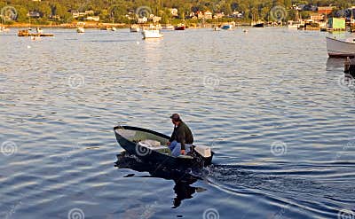 Man in dingy stock image. Image of motorboat, coastline - 2862401