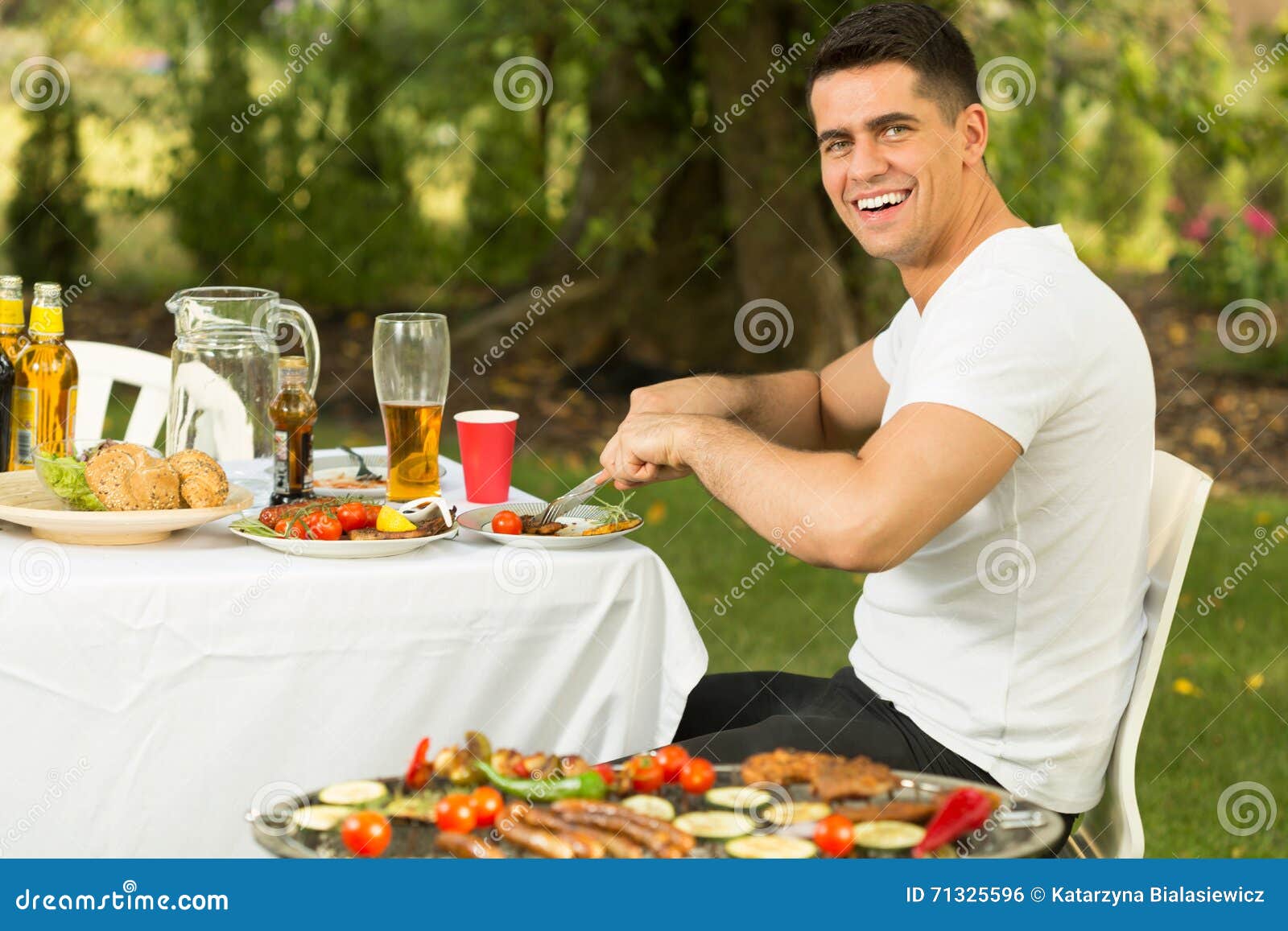 Man and dinner outside stock photo. Image of outside - 71325596