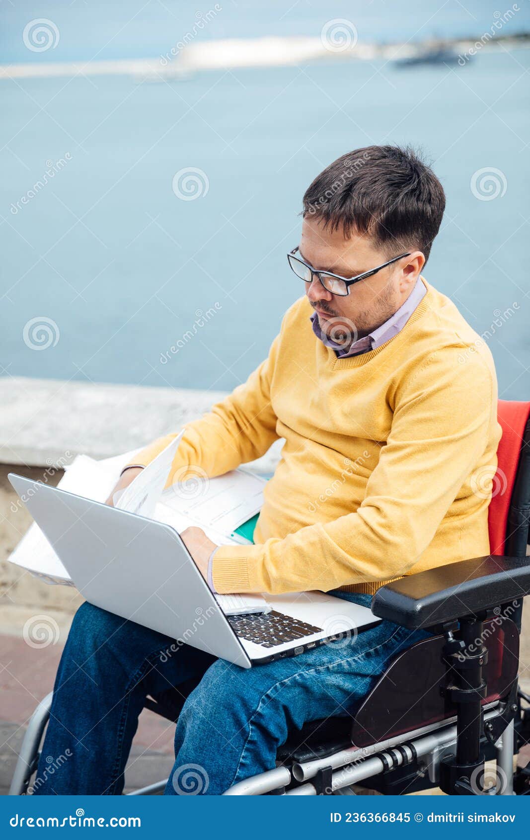 A Man with a Disability in a Disabled Working Business Remotely Stock ...