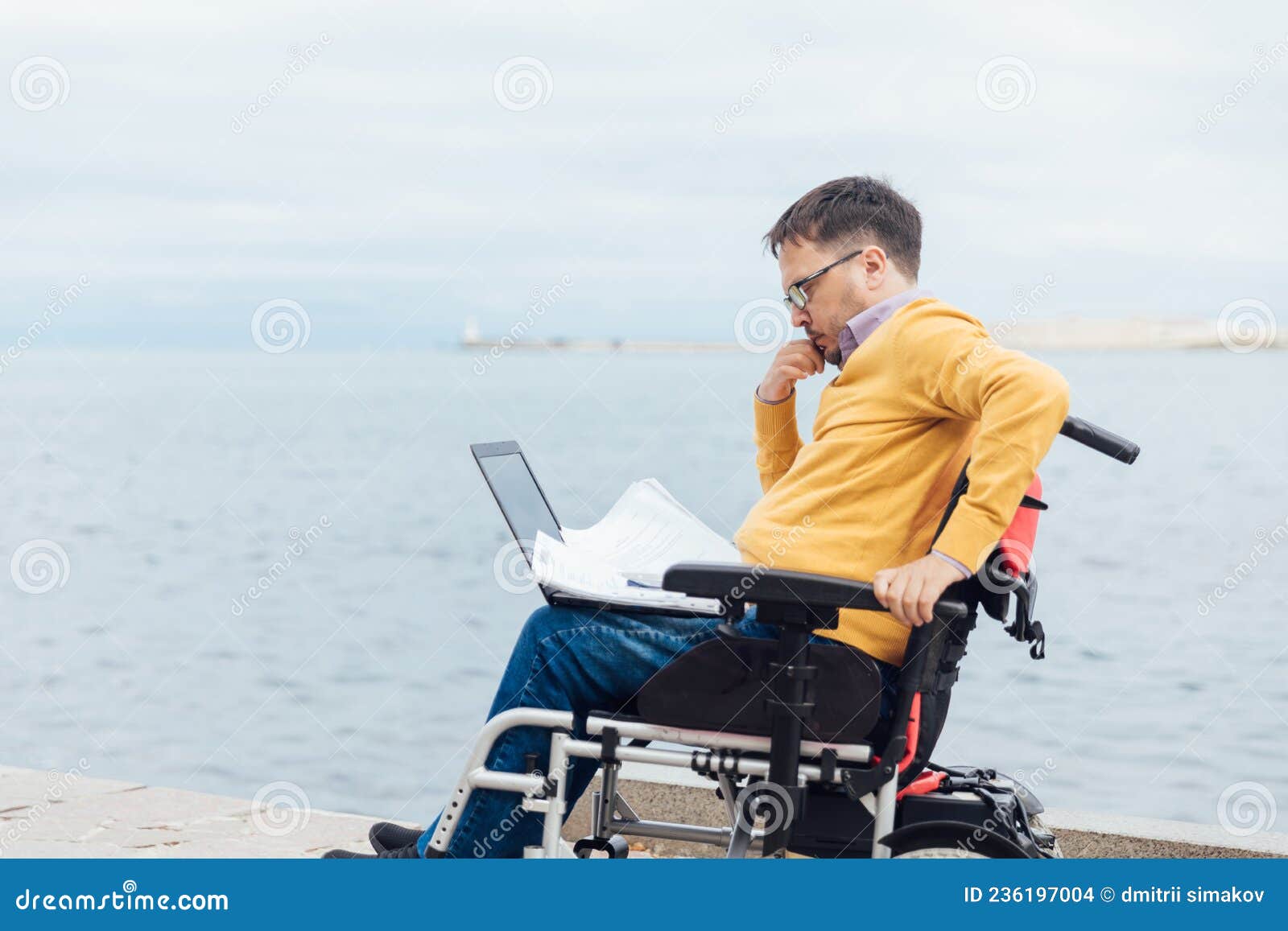 A Man with a Disability in a Disabled Working Business Remotely Stock ...