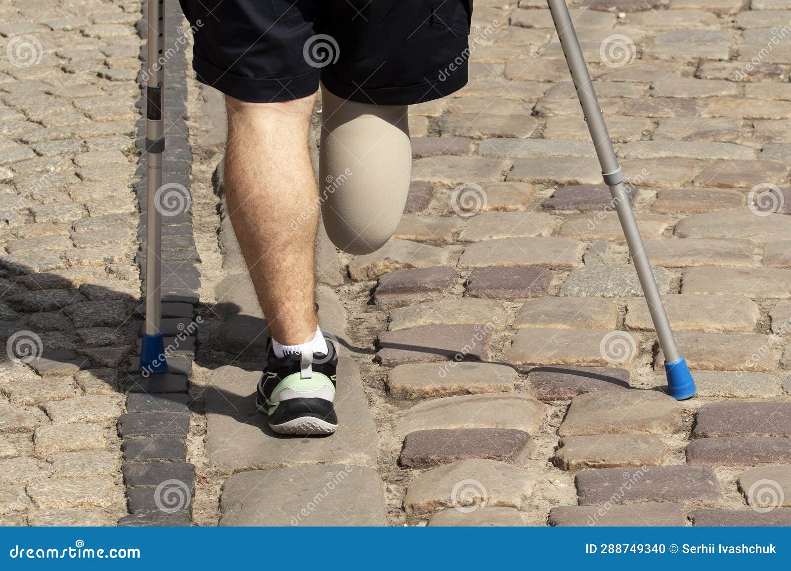 A Man with a Disability Walks on the Sidewalk. Stock Photo - Image of ...