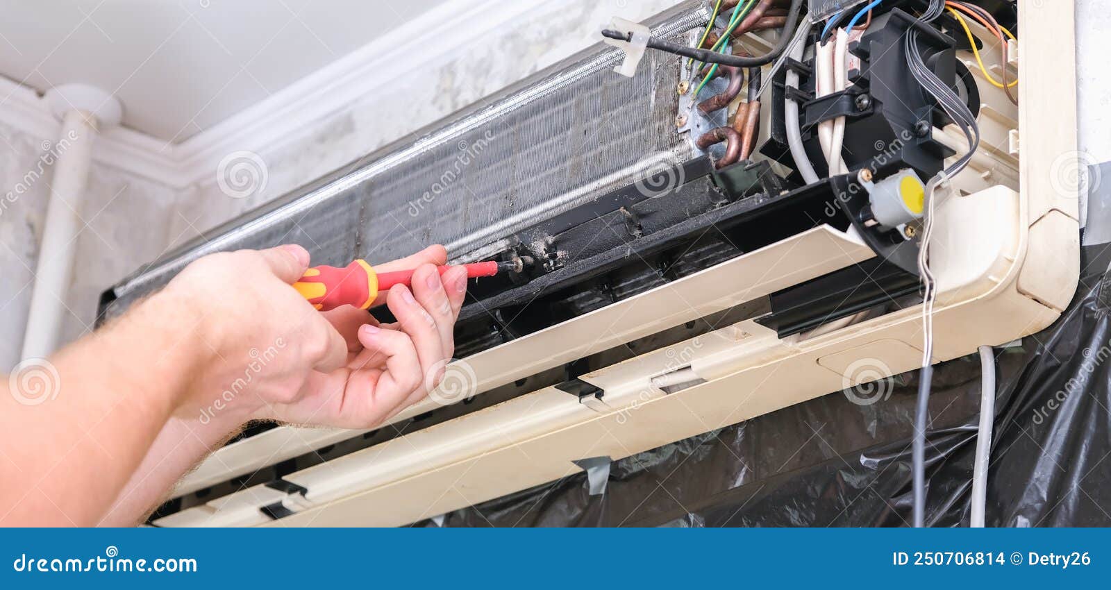 Man Disassembles an Air Conditioner for Repair and Cleaning. Split ...