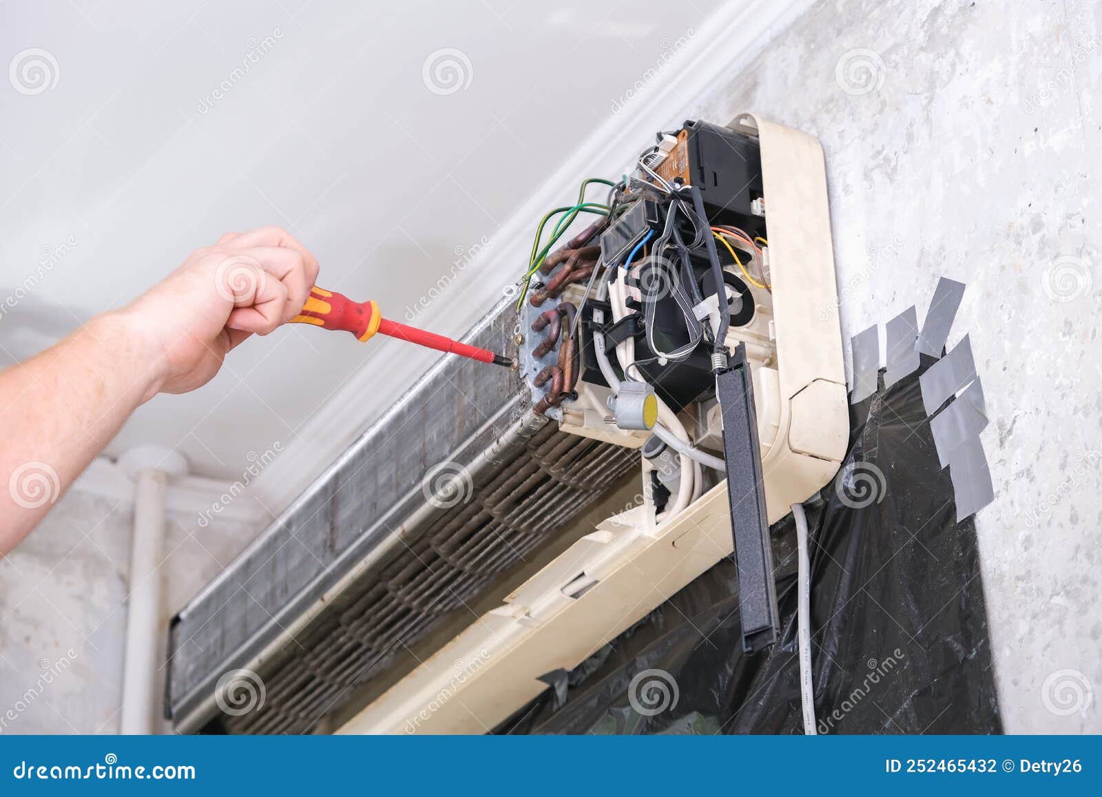 Man Disassembles an Air Conditioner for Repair and Cleaning. Split ...