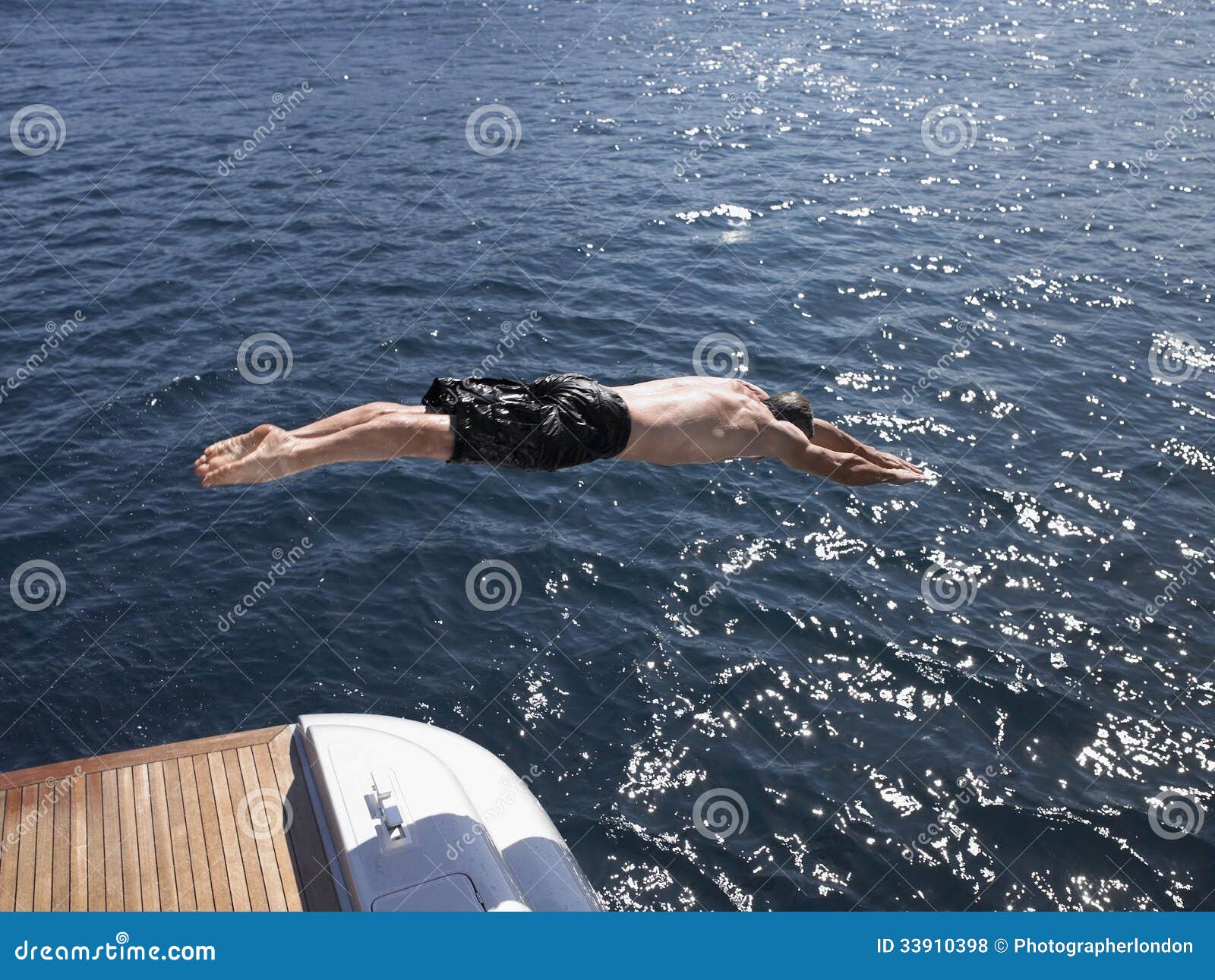 Man Diving into Sea from Yacht Stock Photo - Image of cropped, arms ...