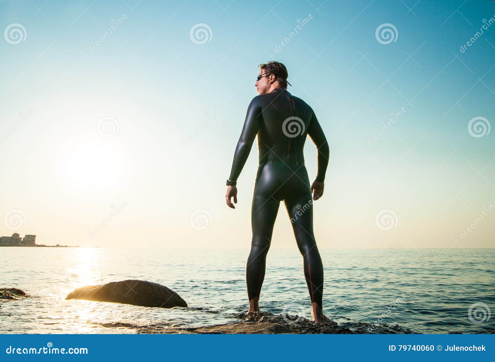 Man in Diving Suit Standing in Waves Stock Photo - Image of diving ...