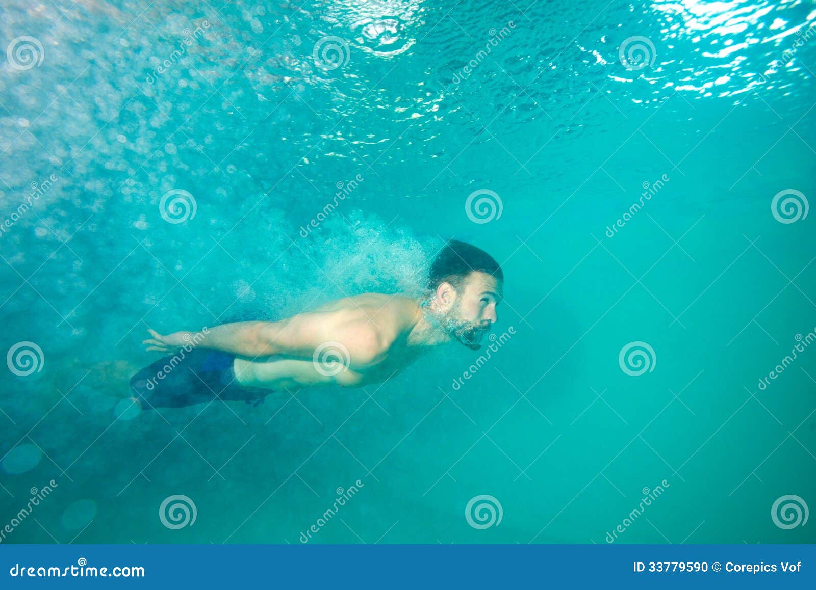 Man diving underwater stock photo. Image of underwater - 33779590