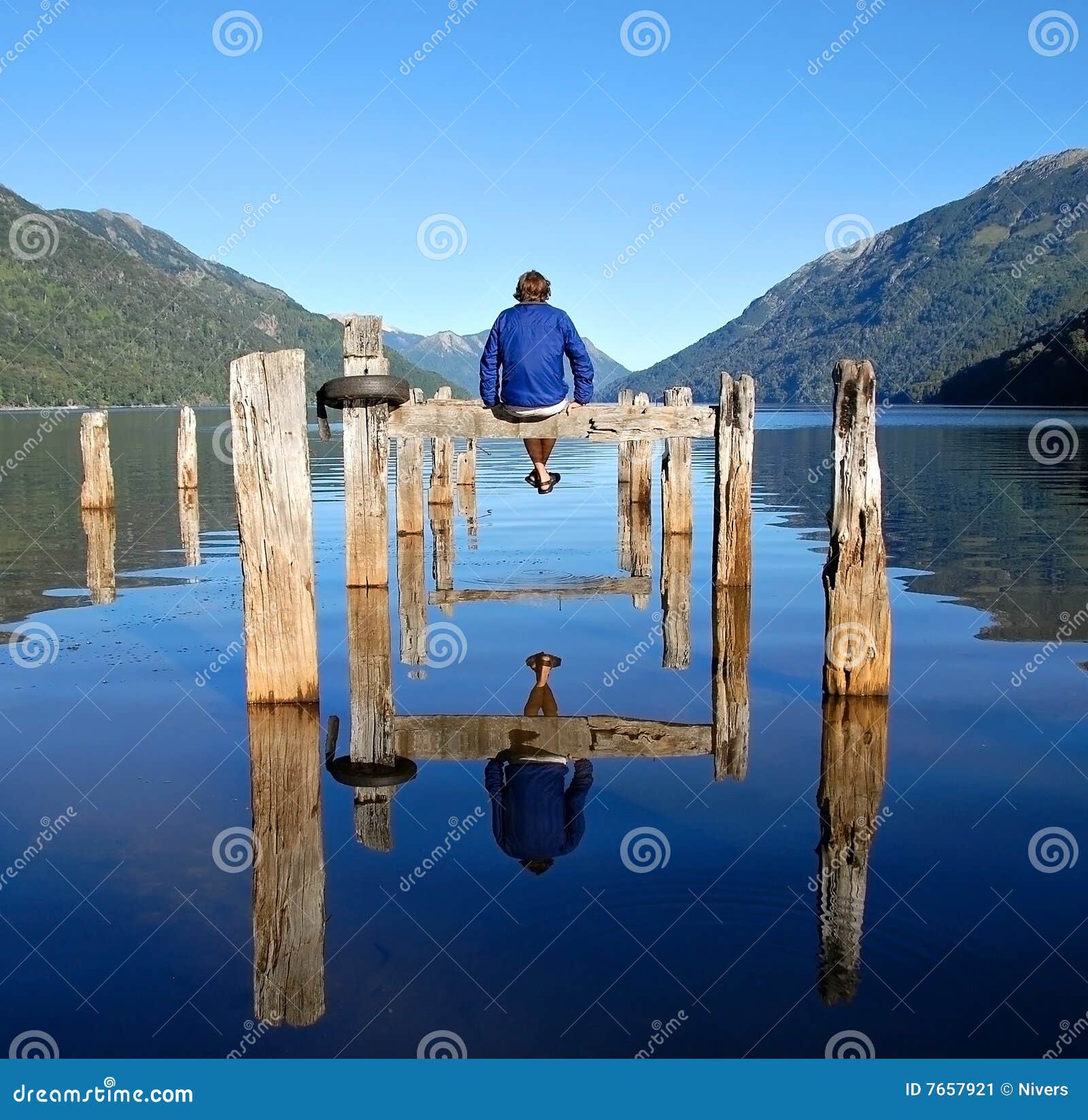 Man on a dock stock image. Image of serene, petting, shore - 7657921