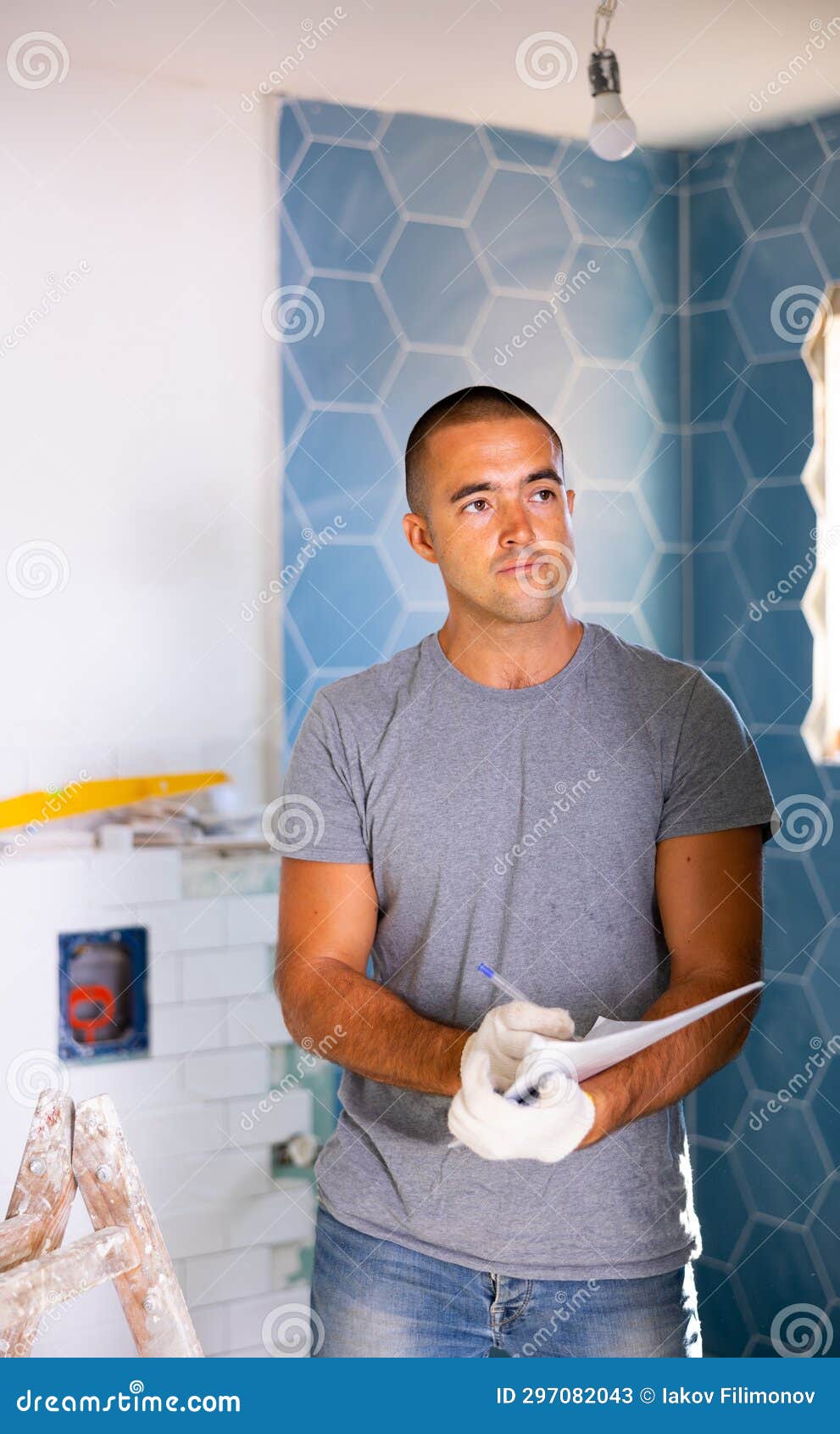 Man with Documents Planning Renovation Works in New Apartment Stock ... Man with Documents Planning Renovation Works in New Apartment Stock ...