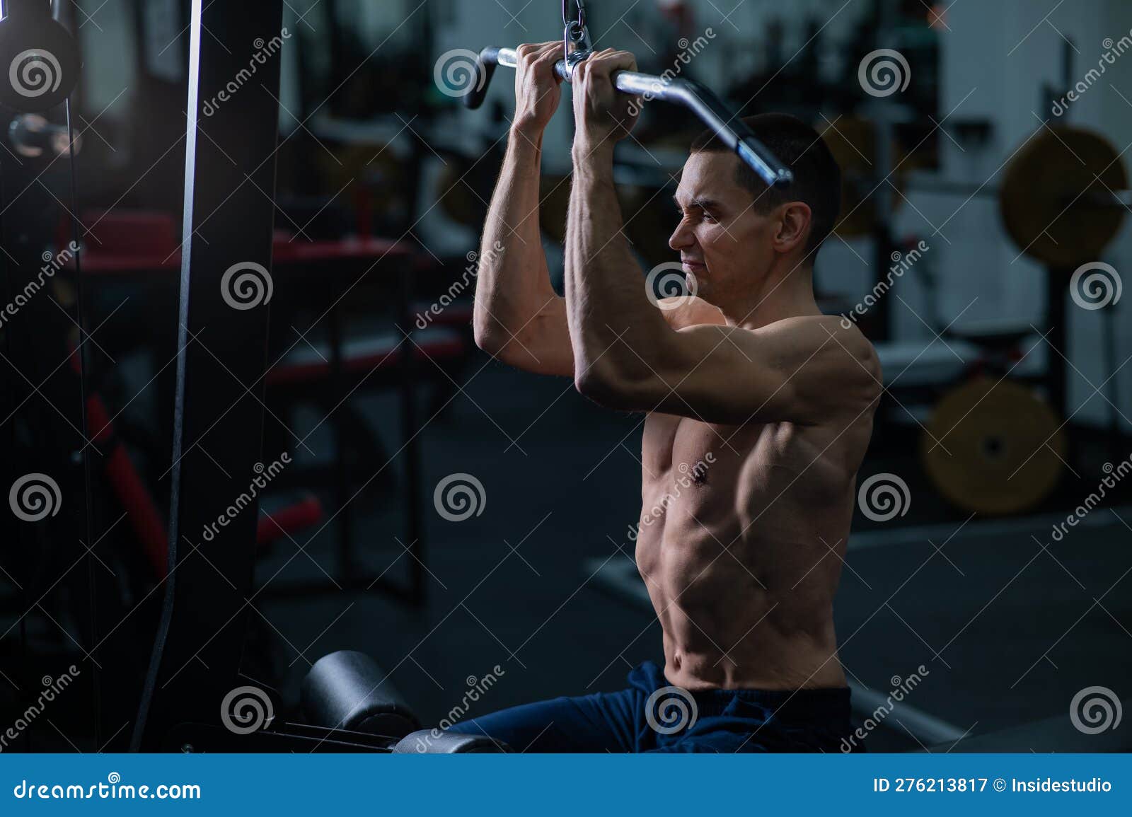 A Man Does a Chest Pulldown in the Gym. Stock Image - Image of brutal ...
