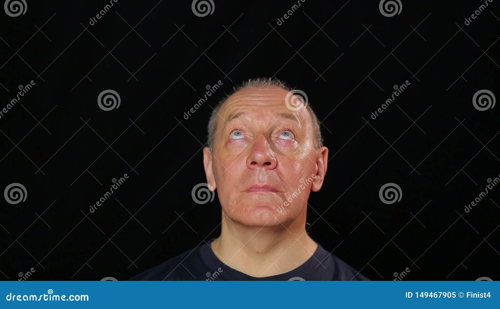A Man Does Exercises For The Eyes By Raising And Lowering His Gaze