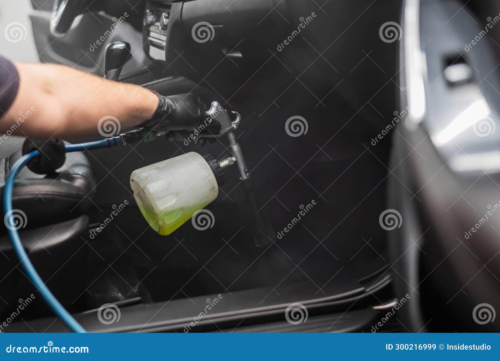 A Man Does Professional Dry Cleaning of a Car Interior. Stock Image ...