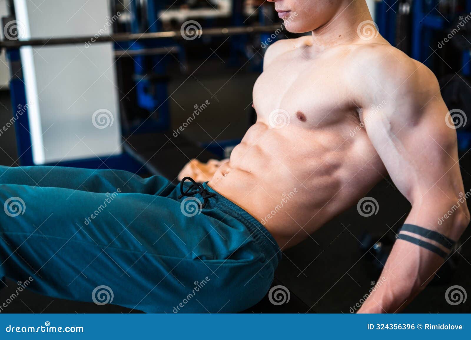 Man Doing Abs Workout on Bench in Gym Stock Photo - Image of athletic ...