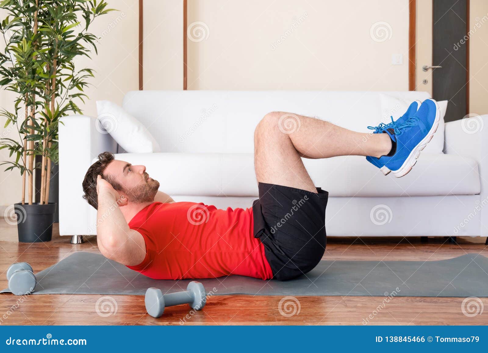 Athletic Young Man Doing Curl Ups Exercise at Home Stock Photo - Image ...