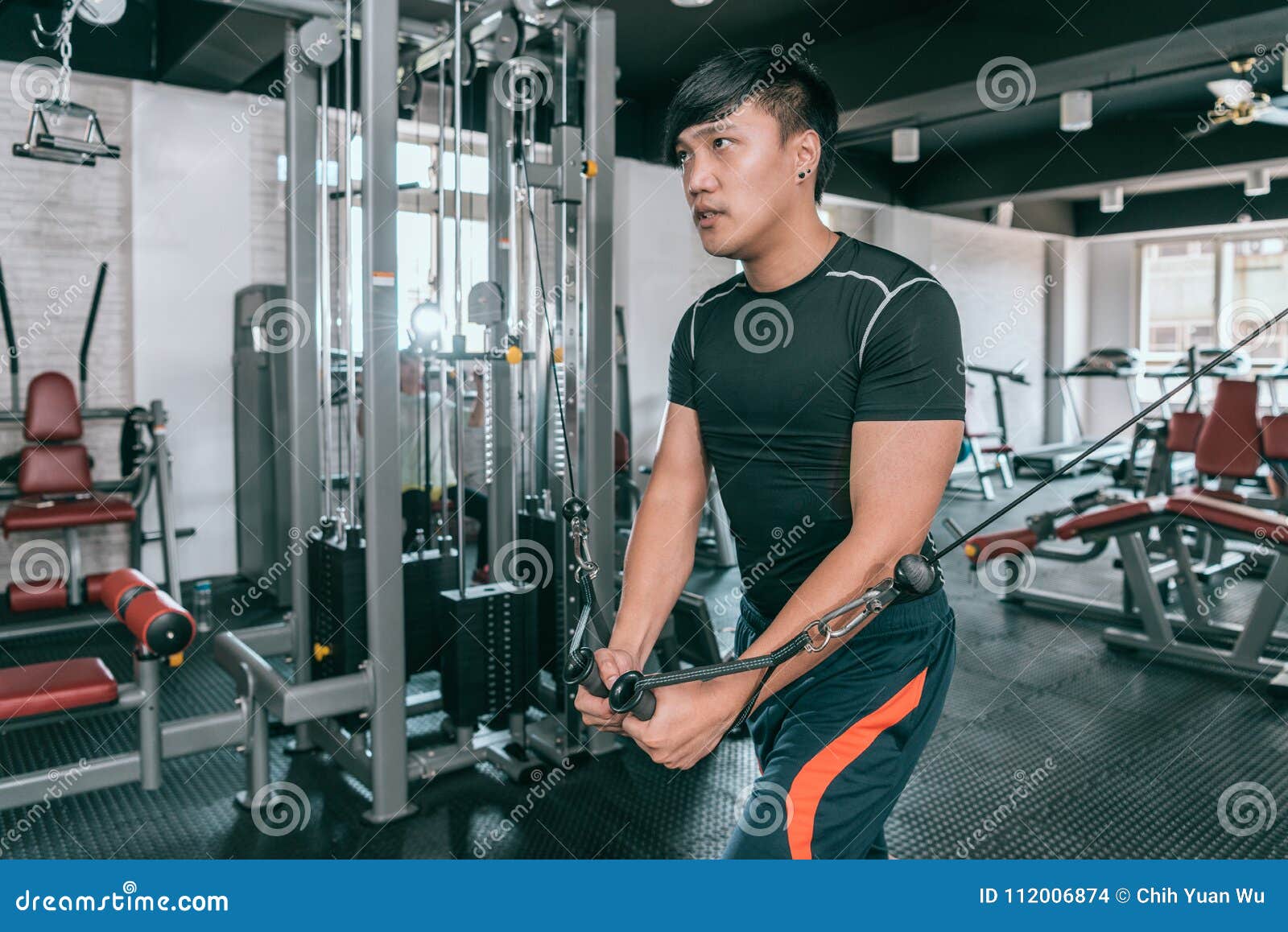 Man Doing Chest Fly on the Cable Wire Machine Stock Photo - Image of ...