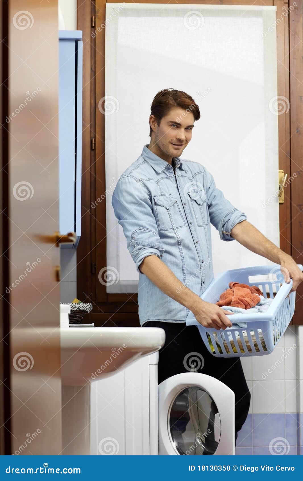 Man Doing Chores with Washing Machine Stock Photo - Image of housework ...
