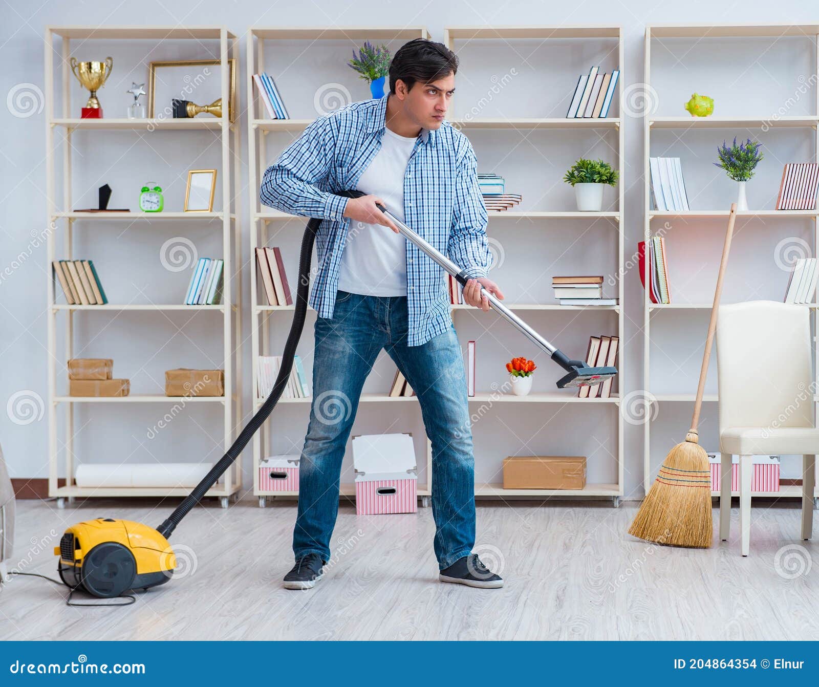 Man doing cleaning at home stock photo. Image of house - 204864354
