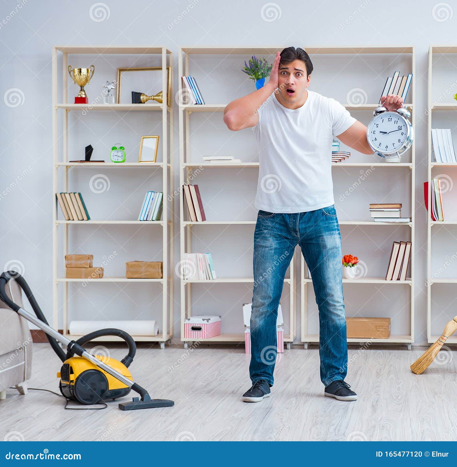 Man doing cleaning at home stock photo. Image of holding - 165477120