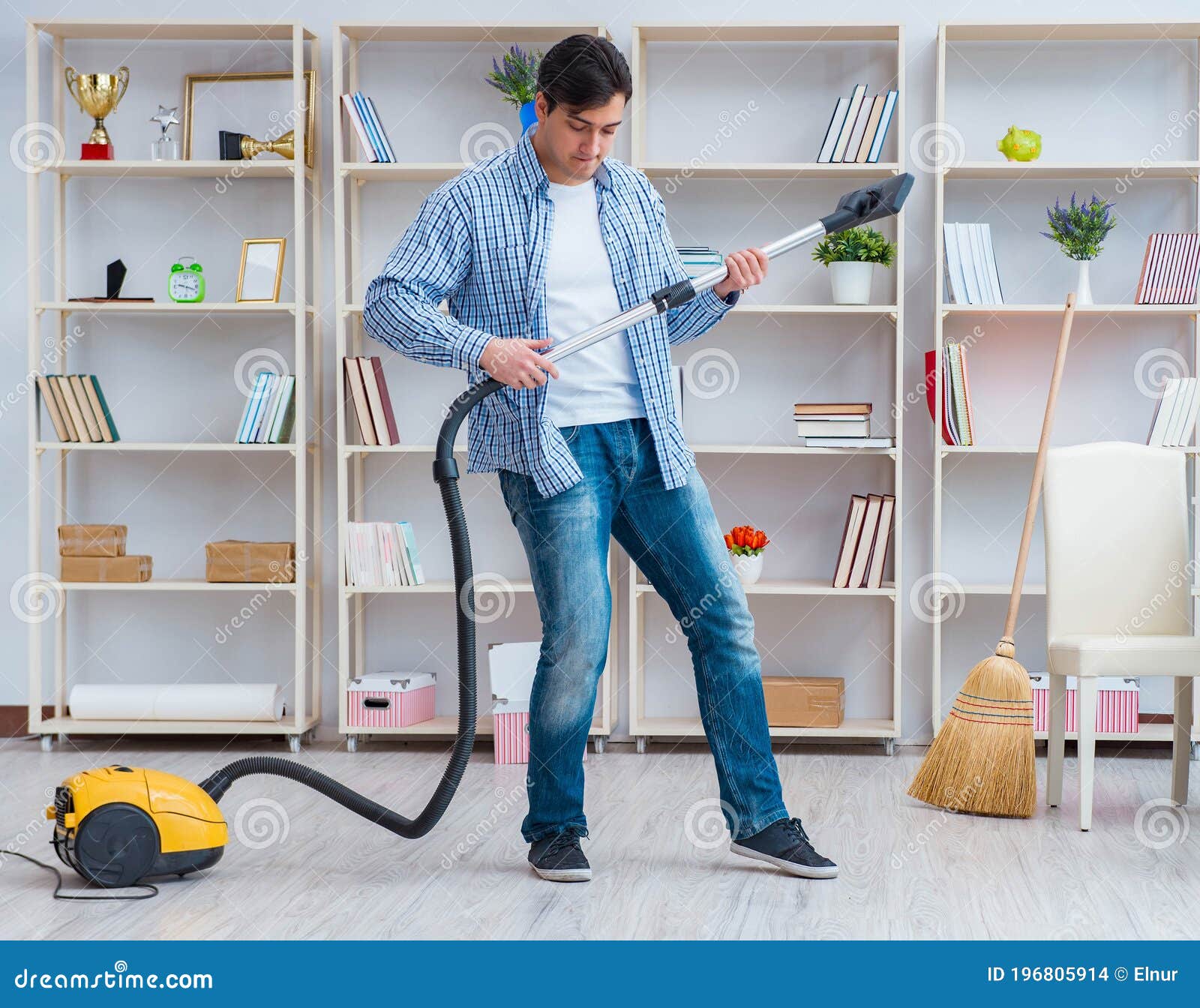 Man doing cleaning at home stock photo. Image of floor - 196805914