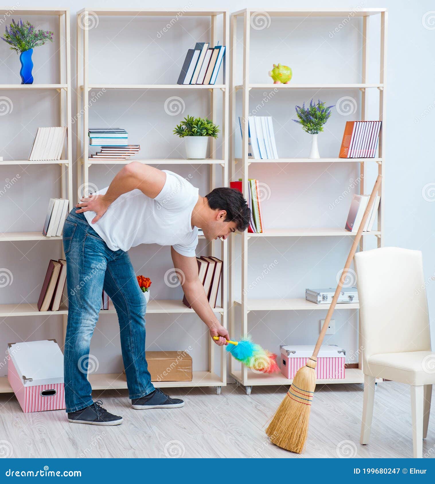 Man doing cleaning at home stock image. Image of dusting - 199680247