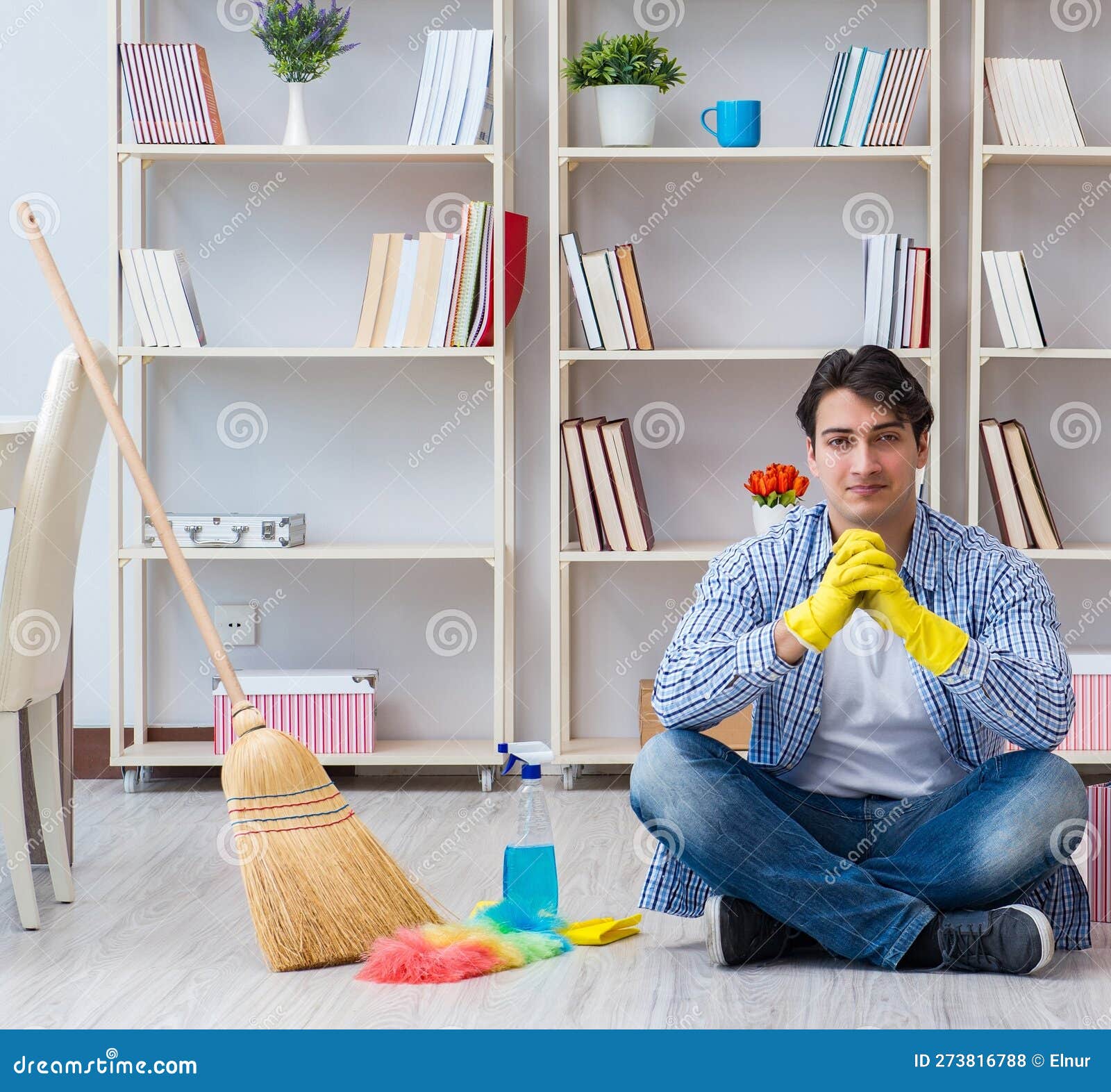 Man doing cleaning at home stock photo. Image of house - 273816788